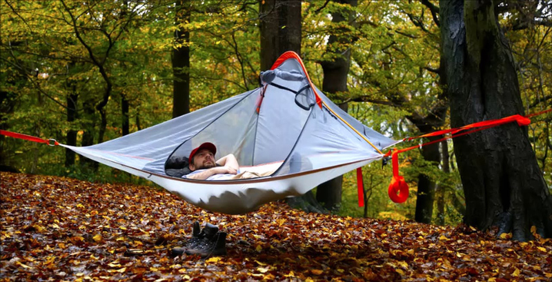A man resting in the Tentsile Hammock.